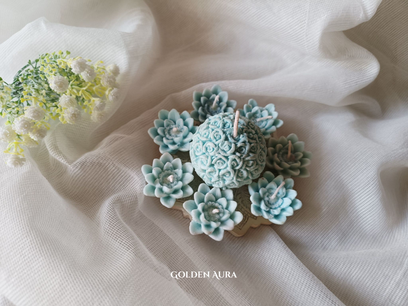 Rose Ball Candle With Floating Candles And A Coaster